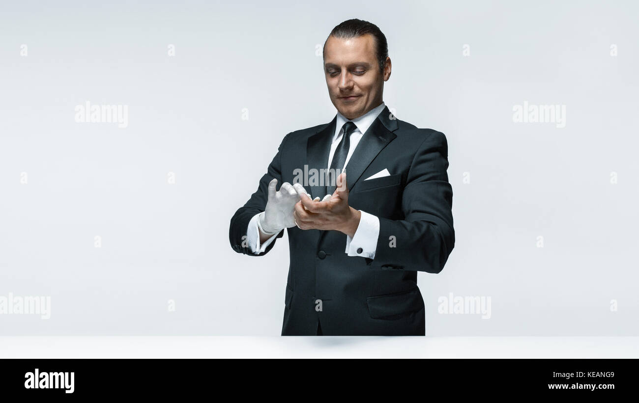 At Your service, well dressed man waiting for orders isolated on white ...