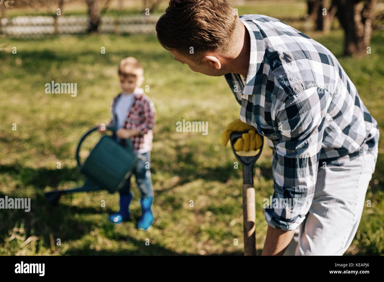 Young gardener standing in semi position Stock Photo - Alamy