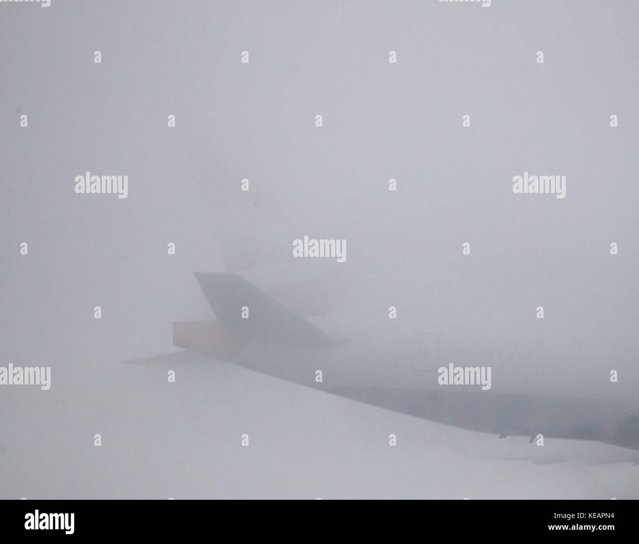 A British Airways plane lands in fog at Heathrow Airport, London Stock ...