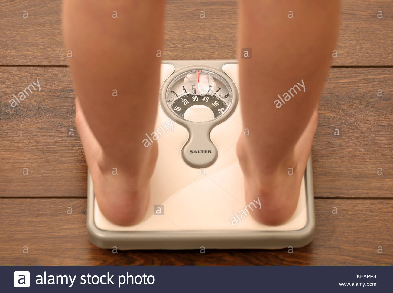 Child On Weighing Scales Stock Photos & Child On Weighing Scales Stock ...