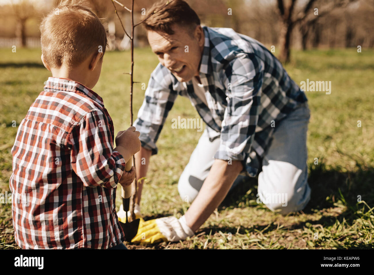 Profile photo of blonde boy that digging soil Stock Photo - Alamy