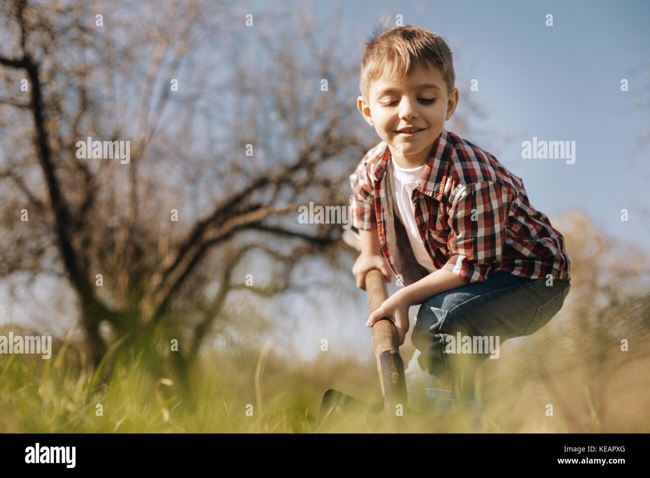 Enigmatical child enjoying working outside Stock Photo - Alamy