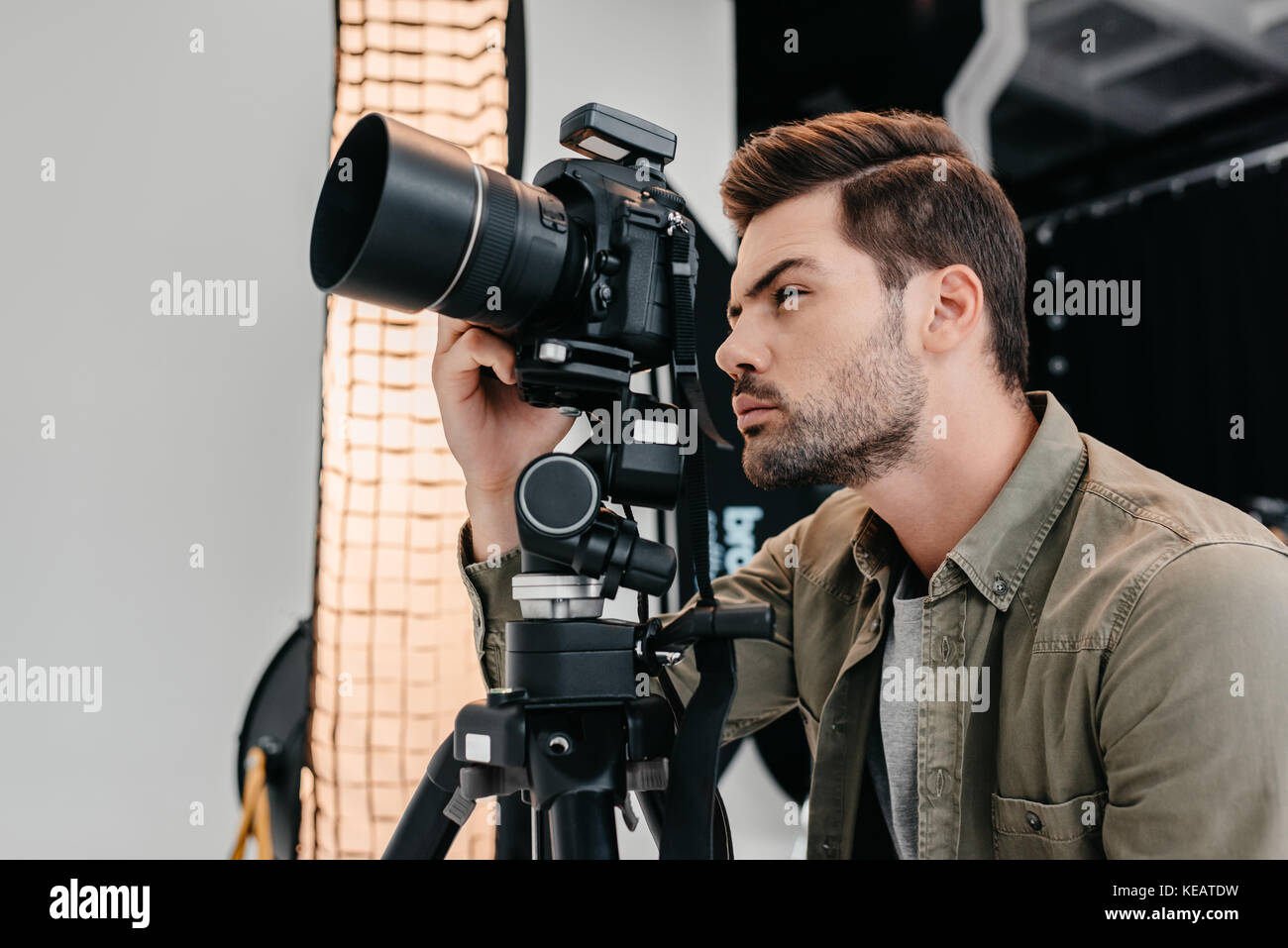 photographer with camera on tripod Stock Photo - Alamy