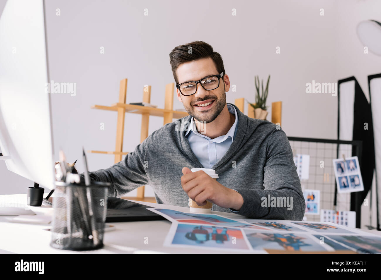 photographer with graphics tablet and photos Stock Photo - Alamy