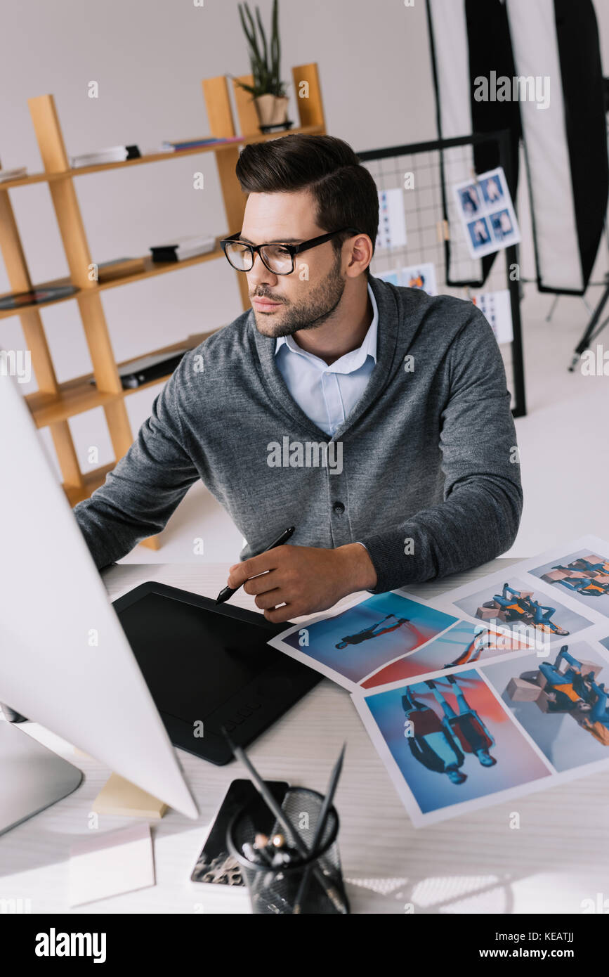 photographer with graphics tablet and photos Stock Photo - Alamy