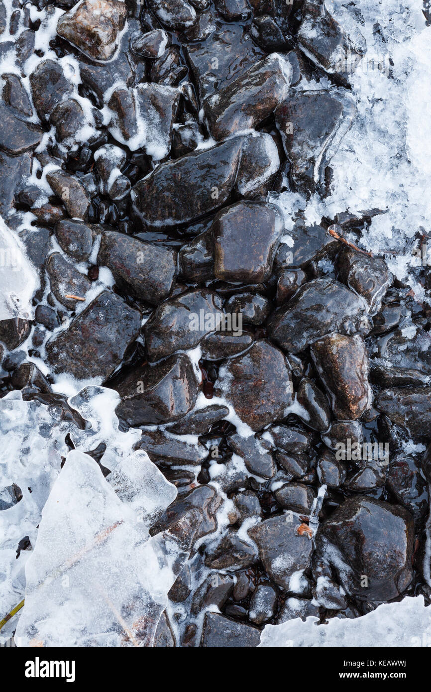 Small rocks covered in ice Stock Photo - Alamy