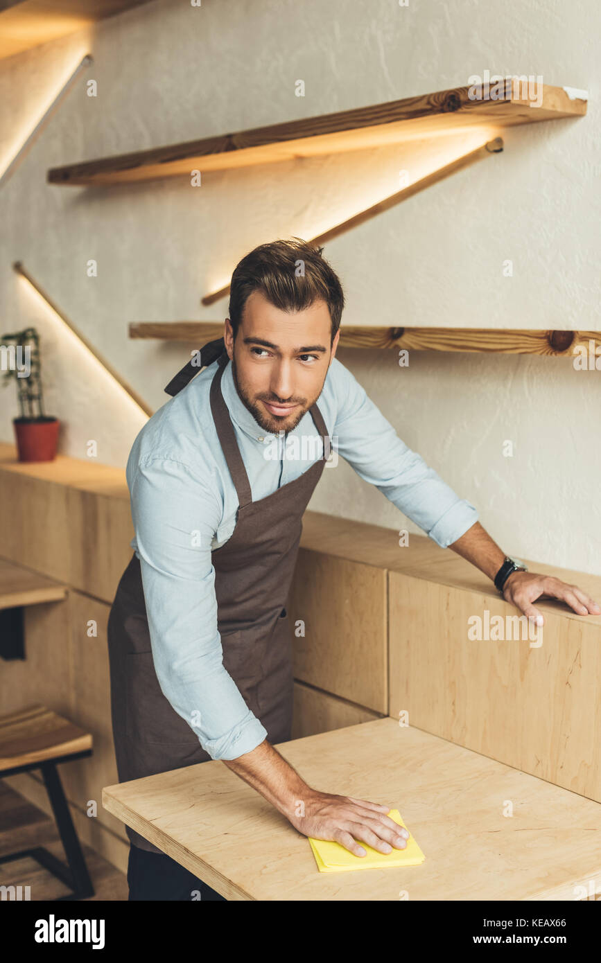 Waiter cleaning table hi-res stock photography and images - Alamy