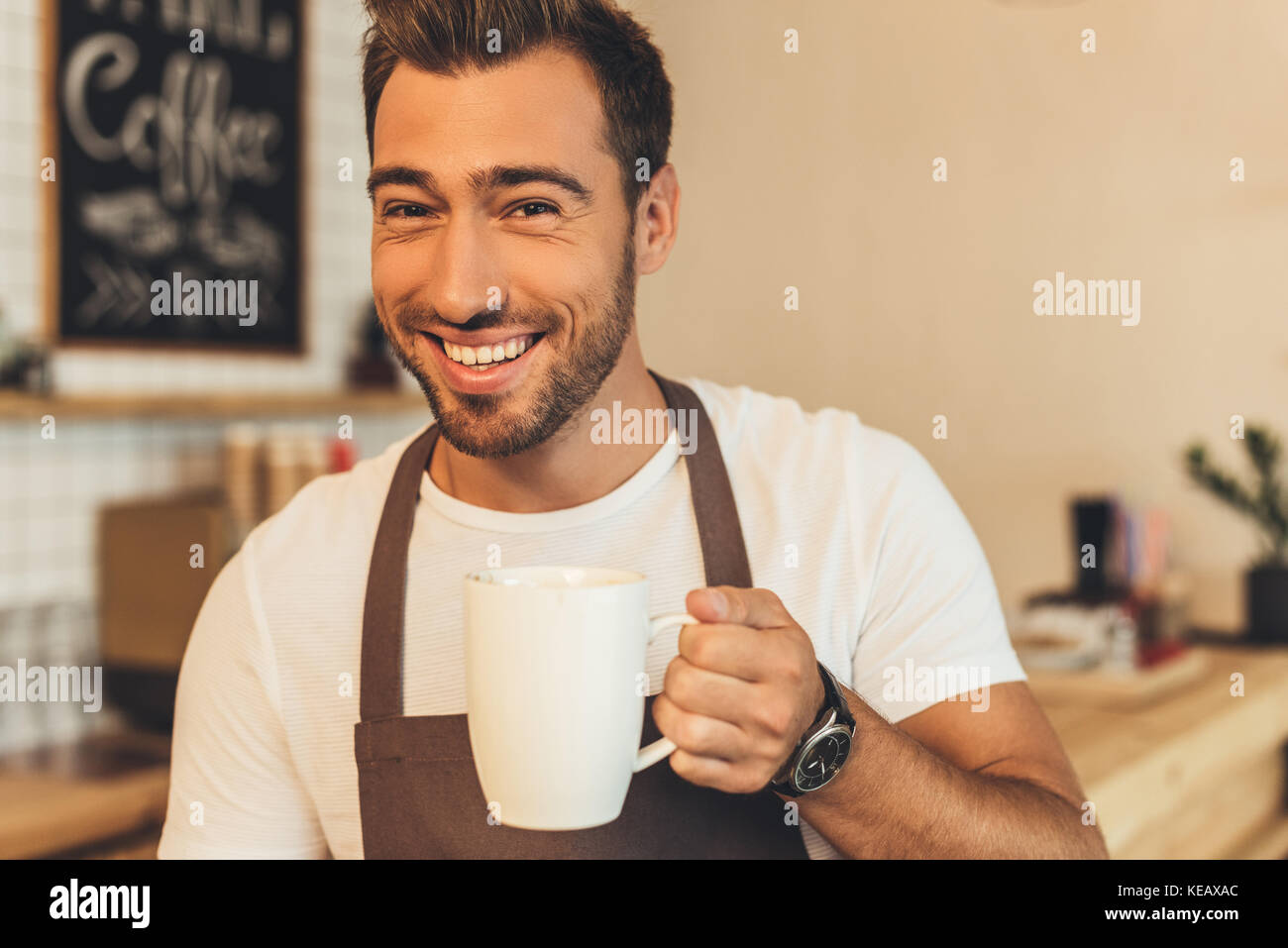 barista with cup of coffee Stock Photo - Alamy