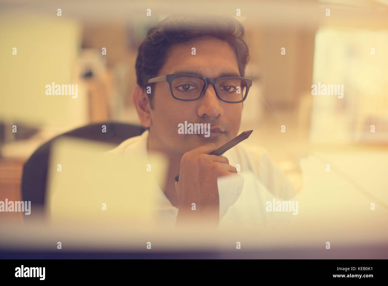 indian business male writing glass wall Stock Photo - Alamy