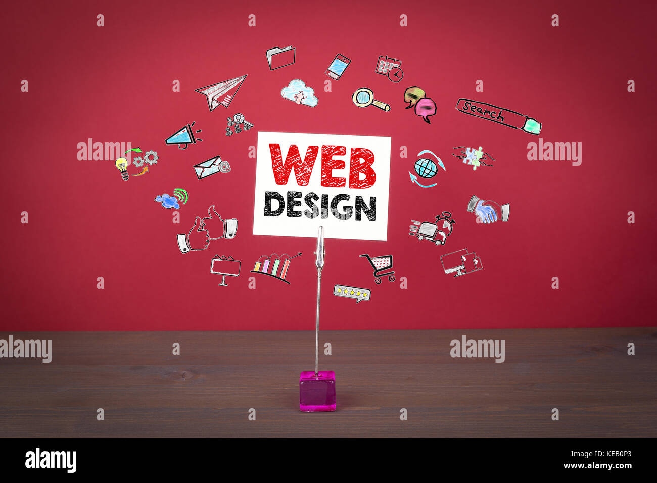 web design concept. Wooden table at the red background Stock Photo - Alamy