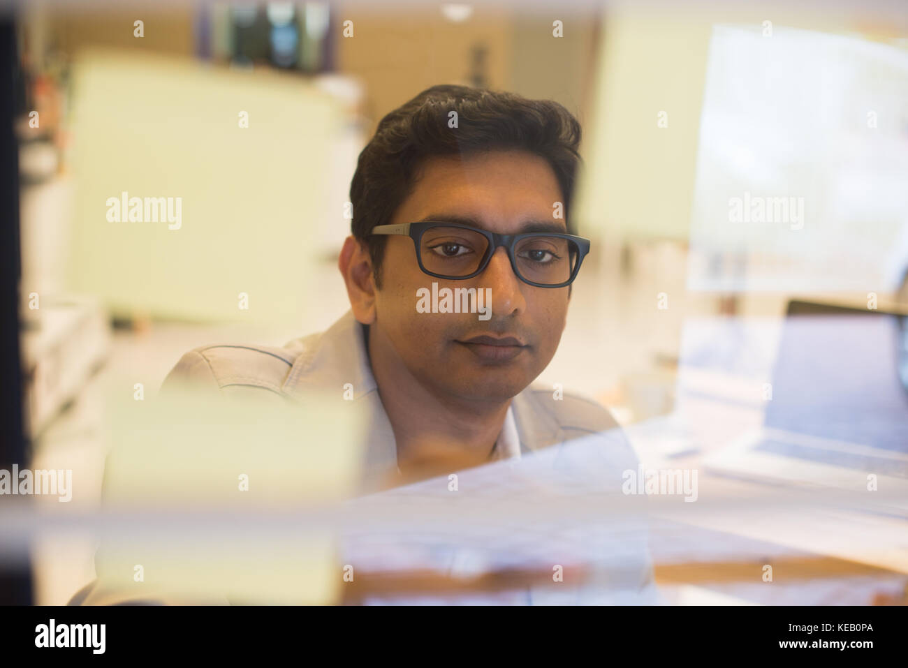 indian business male writing glass wall Stock Photo - Alamy