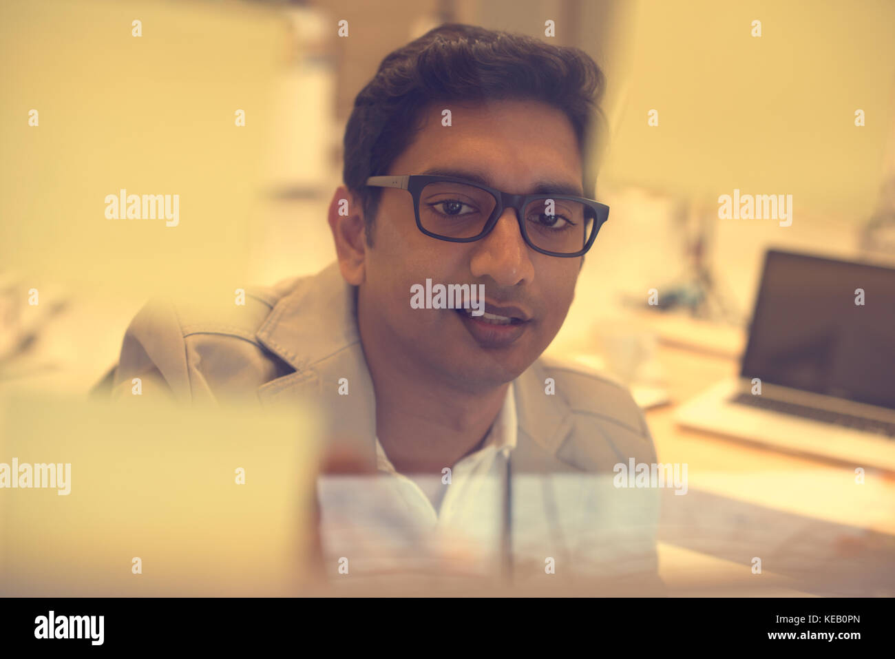 indian business male writing glass wall Stock Photo - Alamy