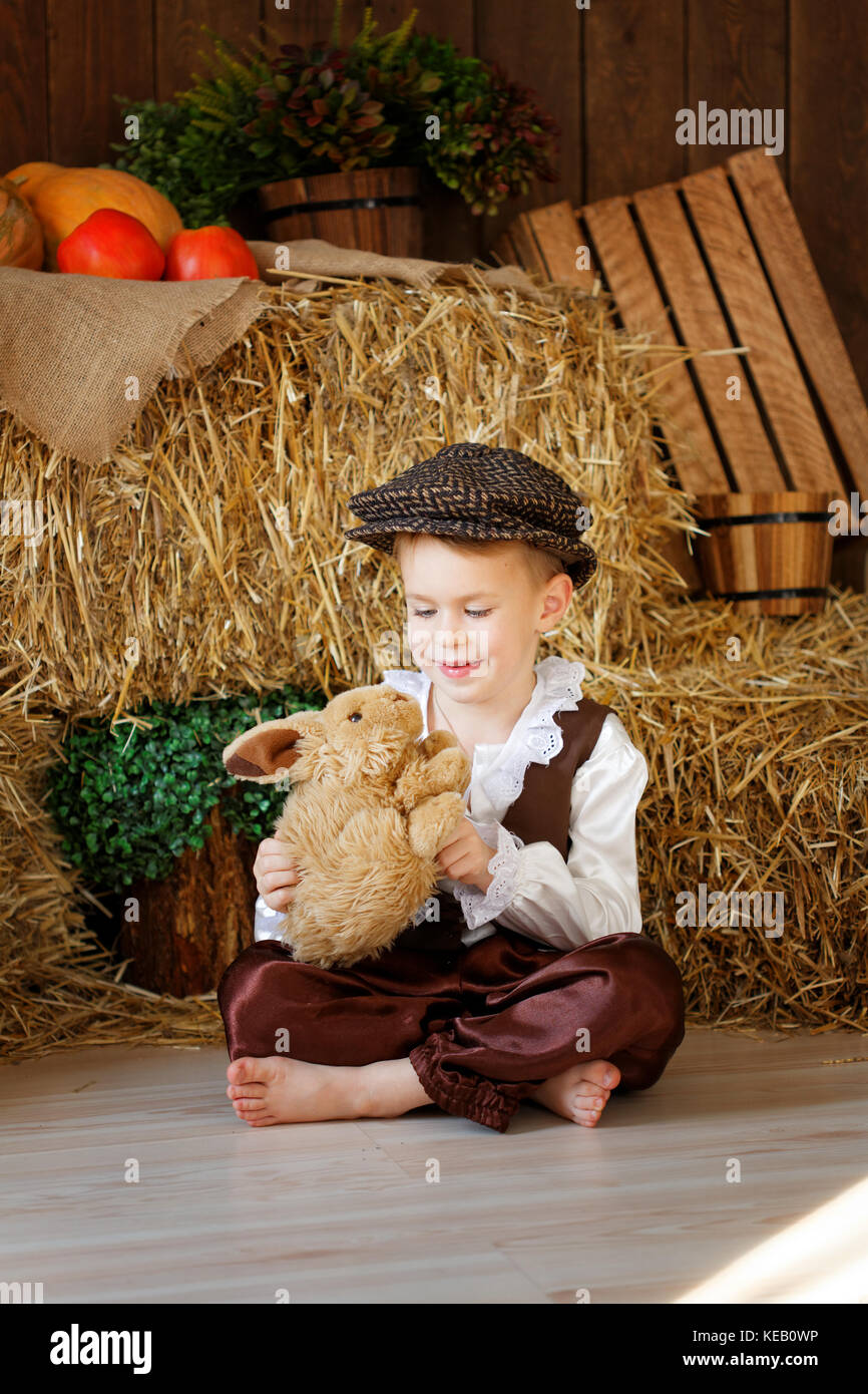 cute little european boy in the cap with blue eyes and bunny Stock ...