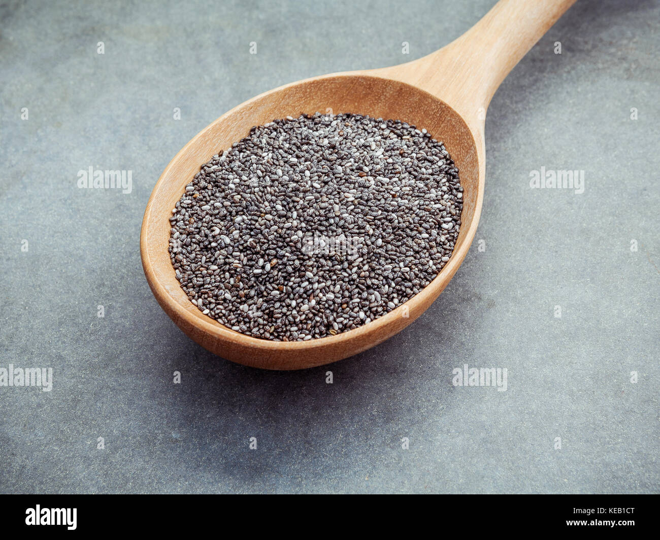 Nutritious chia seeds in wooden spoon for diet food ingredients ...