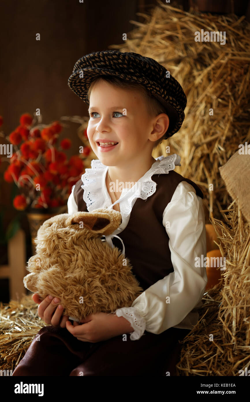 cute little european boy in the cap with blue eyes and bunny Stock ...