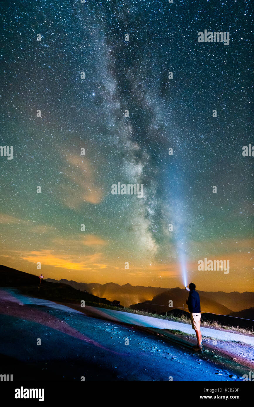 man with a torch night standing at night with milky way Stock Photo - Alamy