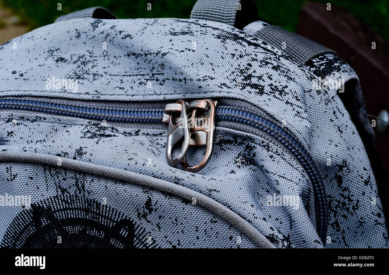 zip on small gray black bag, backpack for school Stock Photo - Alamy