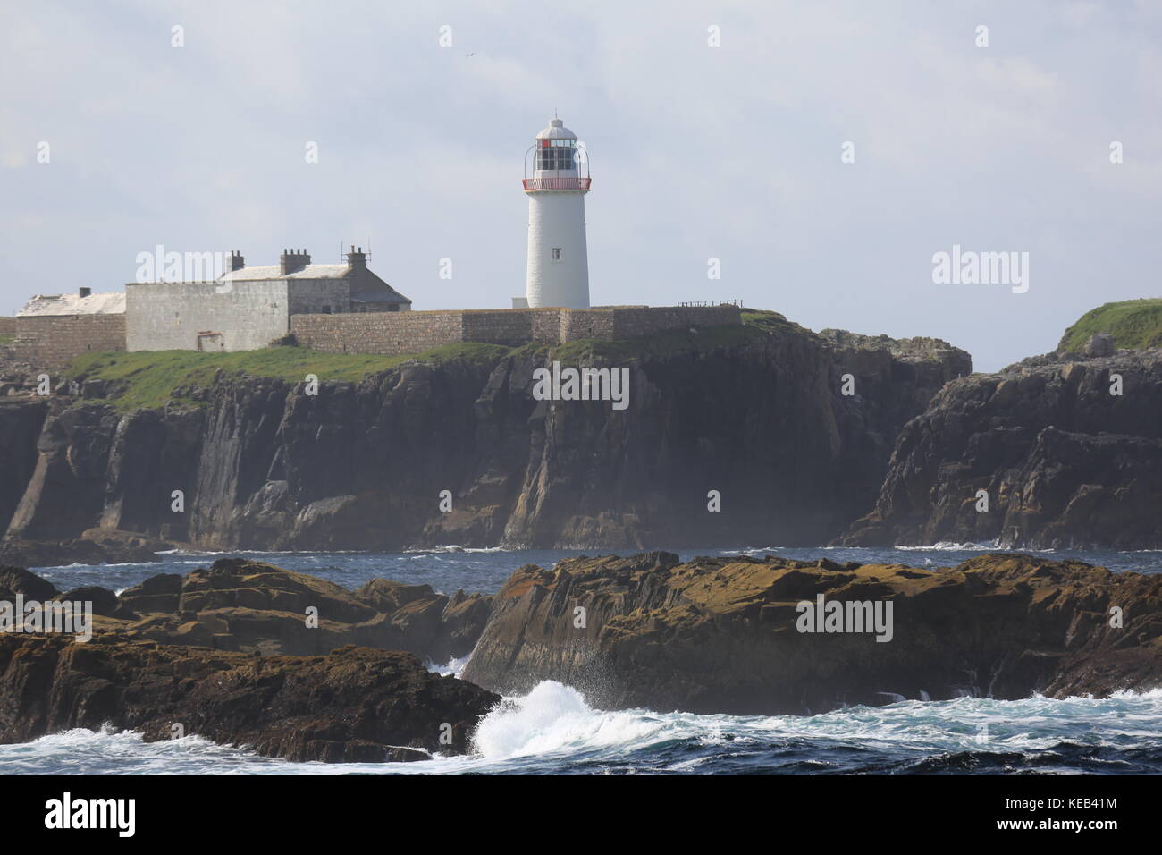 Lighthouse off the coast of Ireland Stock Photo - Alamy