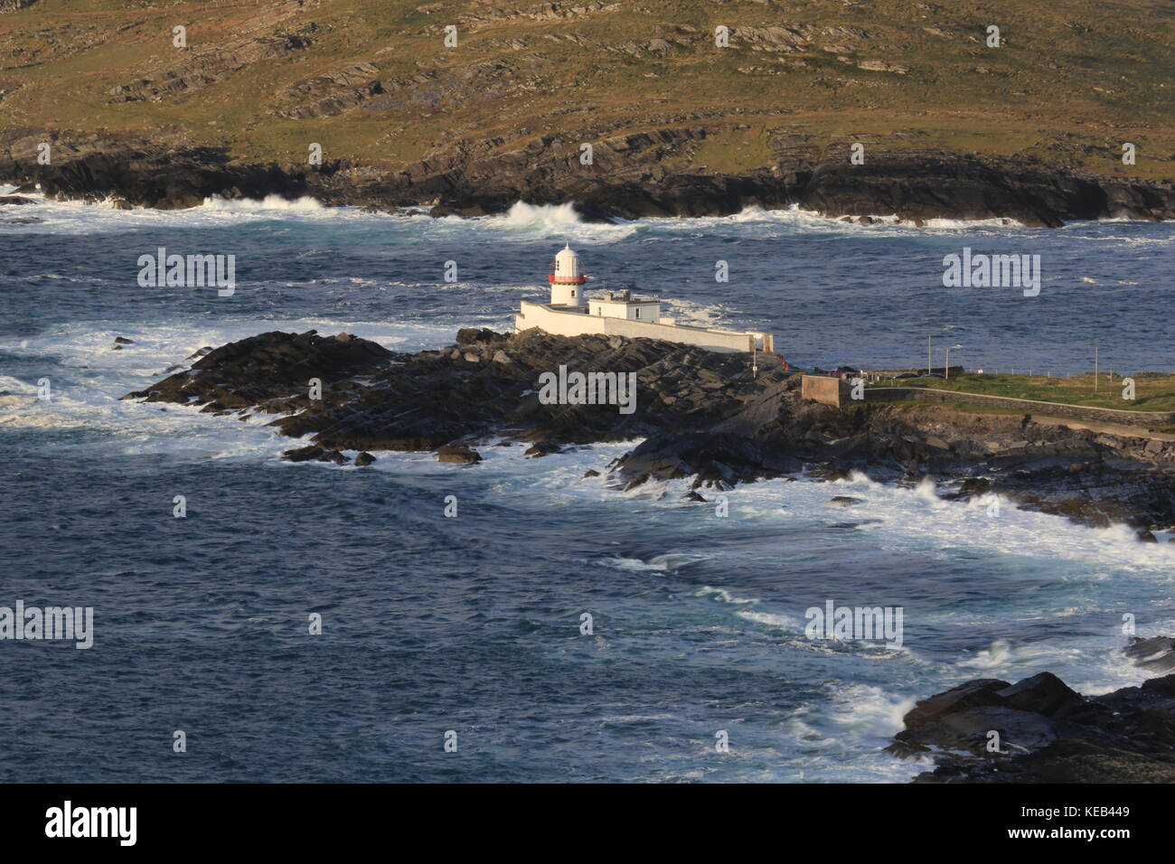 Lighthouse off the coast of Ireland Stock Photo - Alamy
