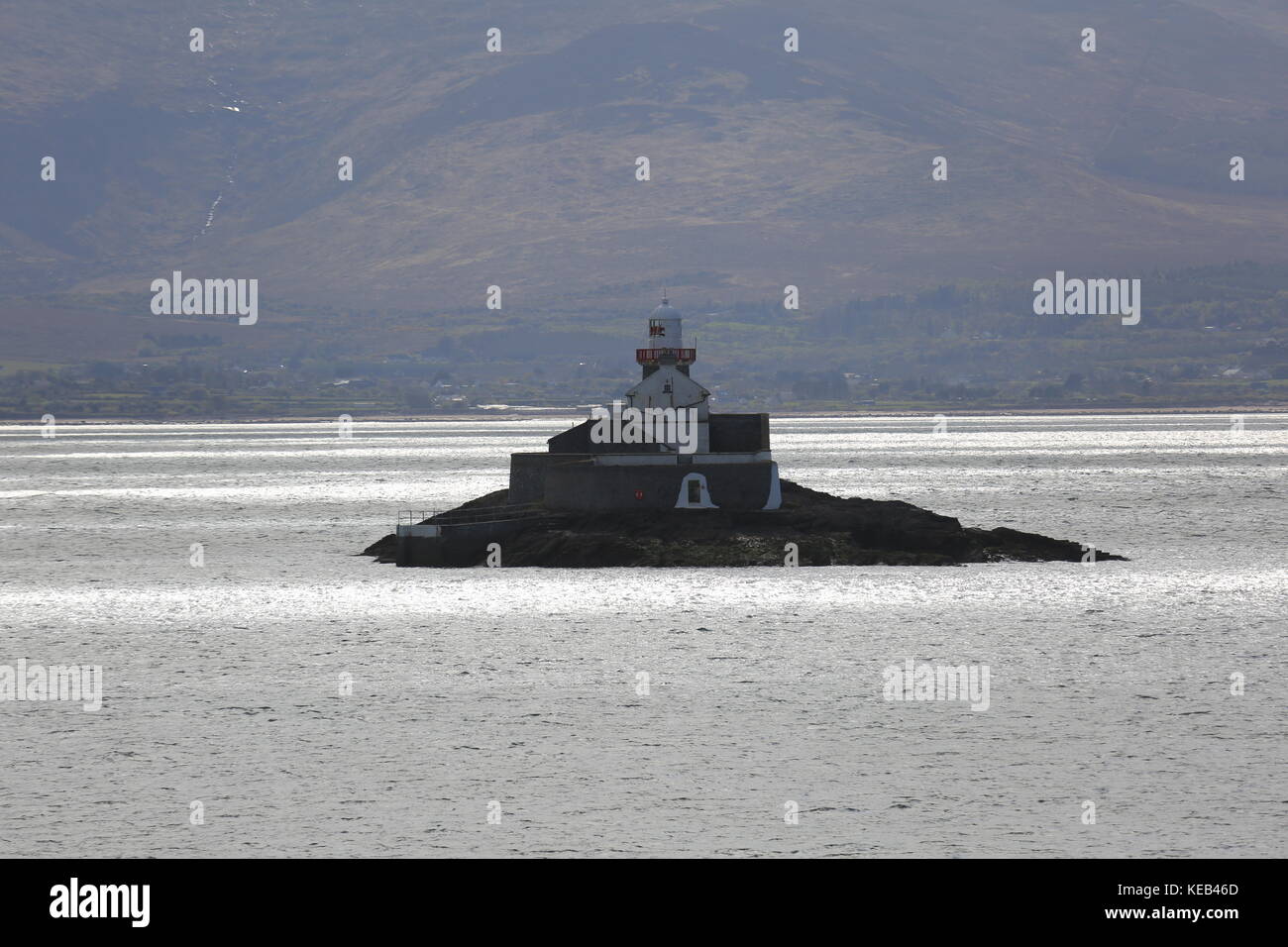 Lighthouse off the coast of Ireland Stock Photo - Alamy