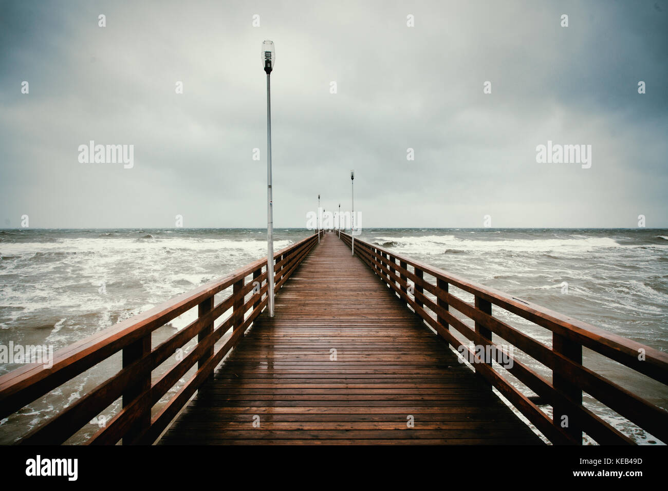 Long wooden pier at the sea Stock Photo - Alamy