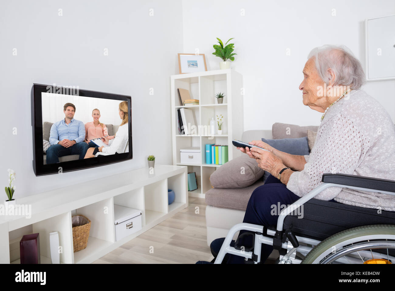 Grandmother On Wheelchair Watching Movie On Television At Home Stock ...