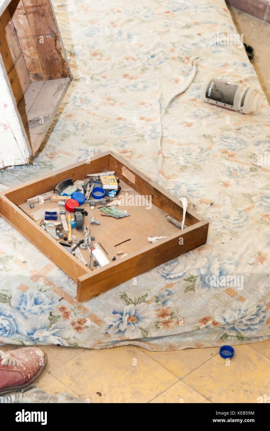 Abandoned home interior with objects on the floor - clothes and ...