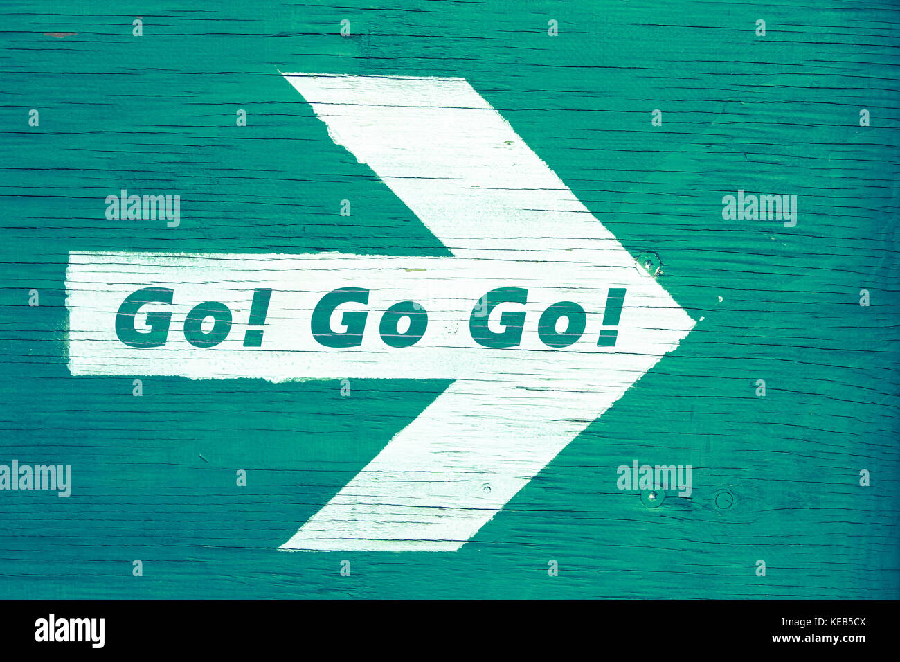 "Go! Go! Go!" text written on a white directional arrow pointing ...