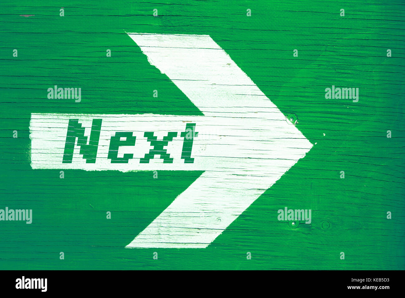 "Next" text written on a white directional arrow pointing towards right ...