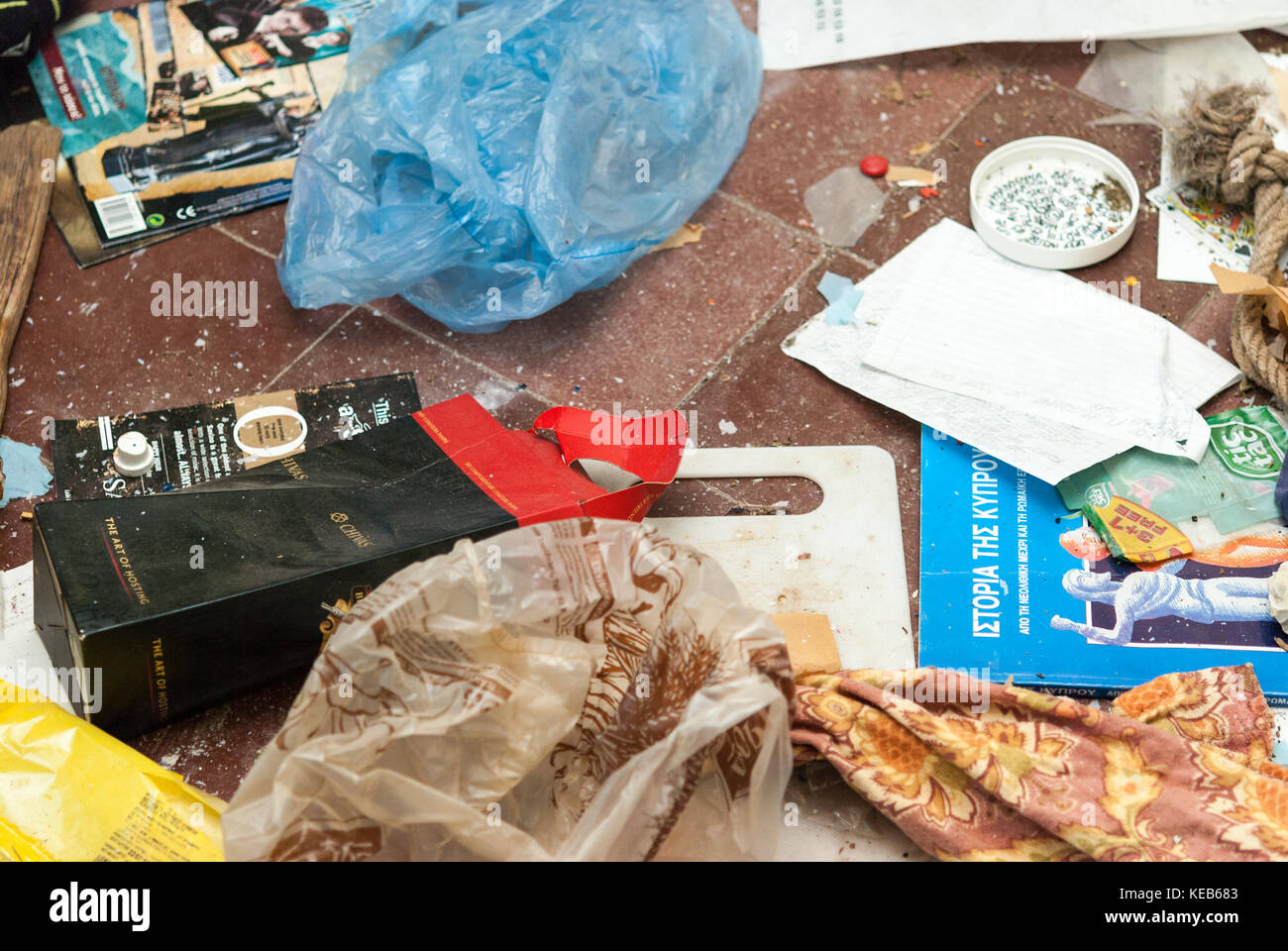 Abandoned home interior with objects on the floor - clothes and ...