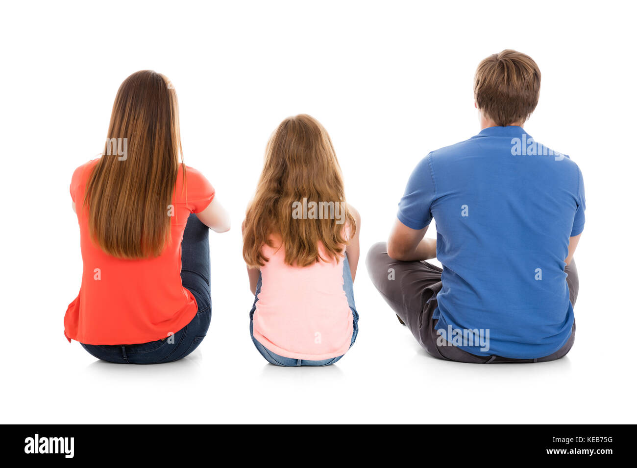 Rear View Of A Family Sitting On White Background Stock Photo - Alamy