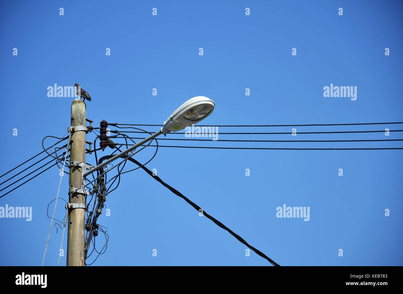 Lamp post with many cables that run in different directions Stock Photo ...