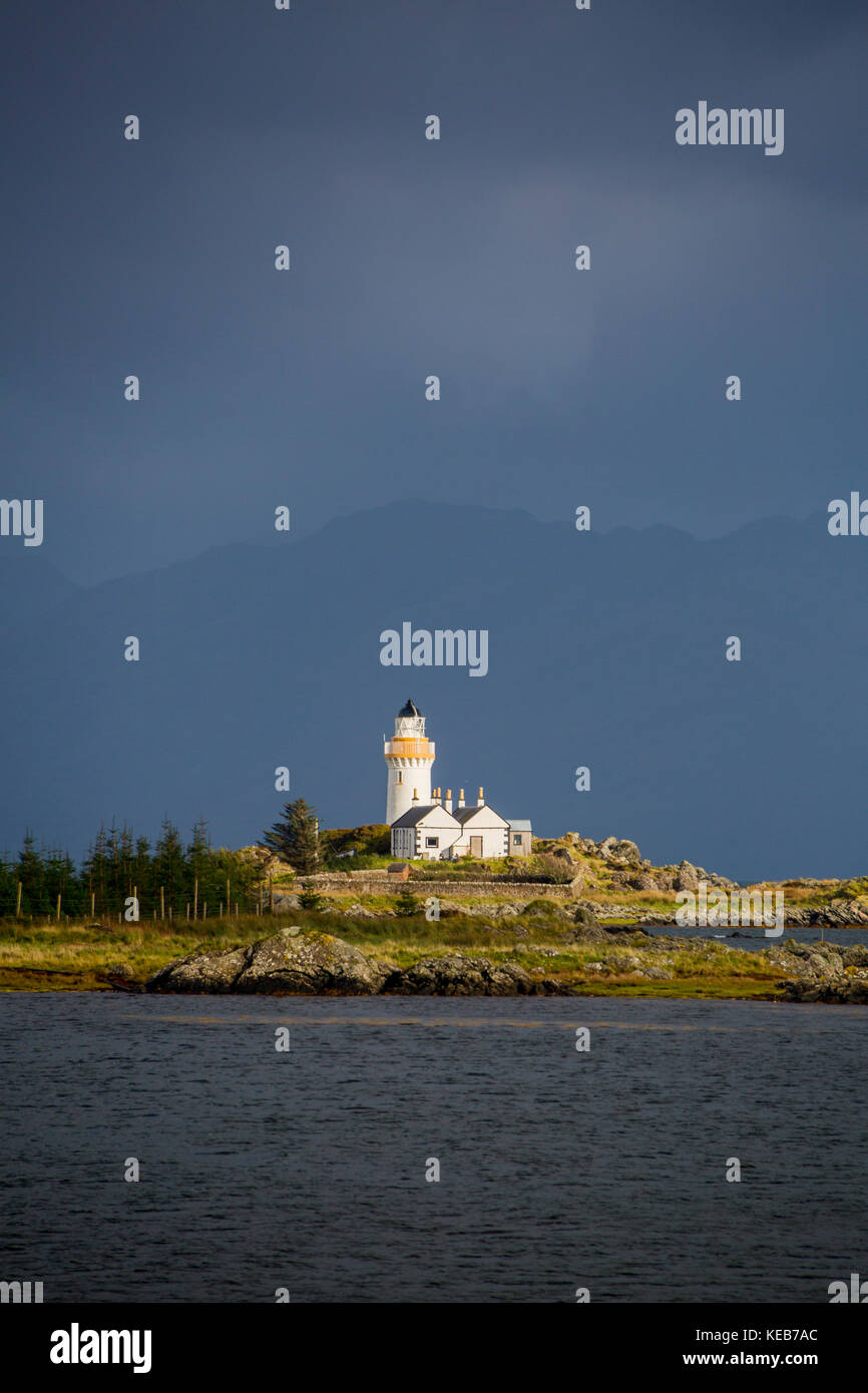 Late afternoon light catches Ornsay lighthouse on the small islet of ...