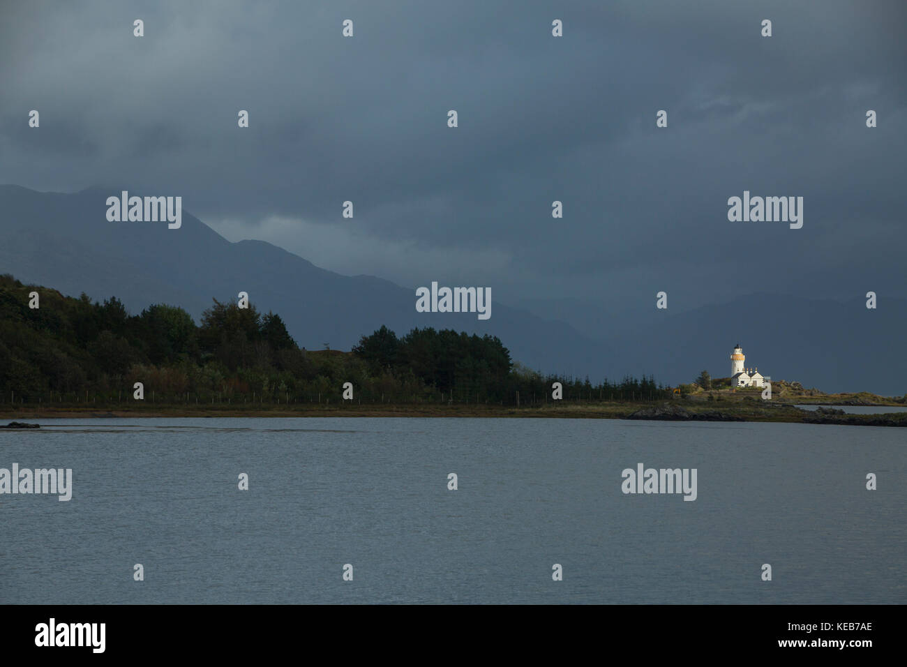 Late afternoon light catches Ornsay lighthouse on the small islet of ...