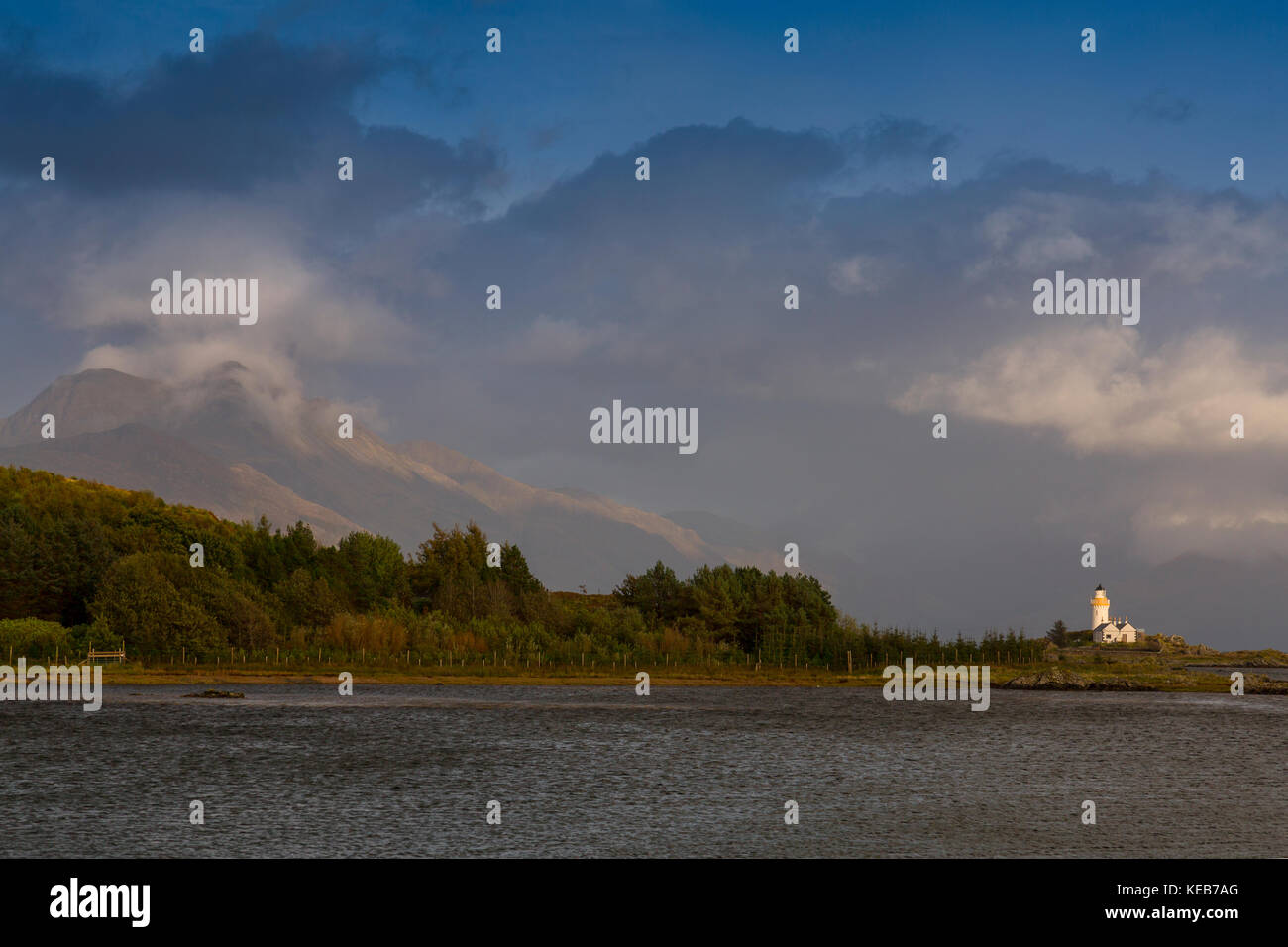Late afternoon light catches Ornsay lighthouse on the small islet of ...