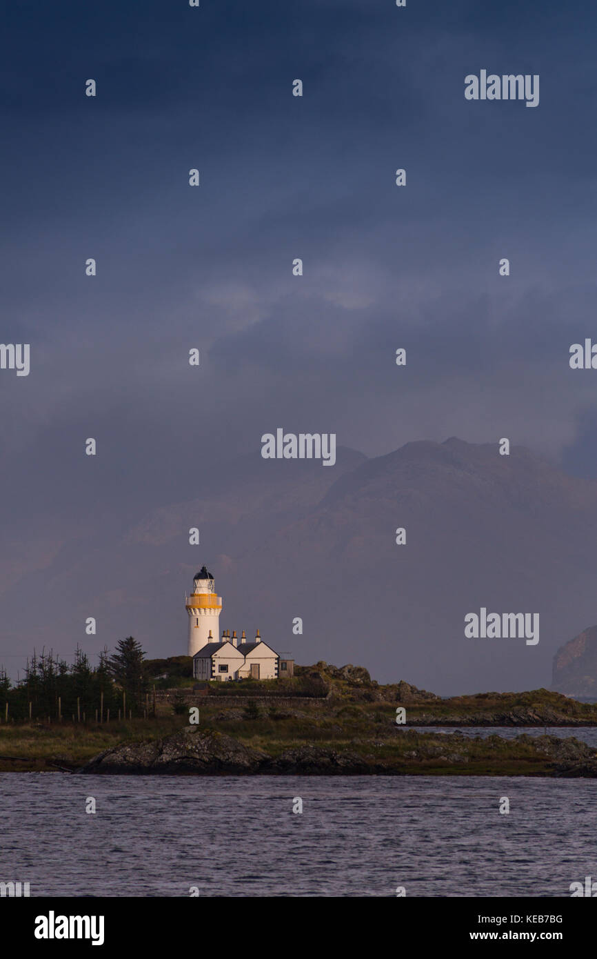 Late afternoon light catches Ornsay lighthouse on the small islet of ...