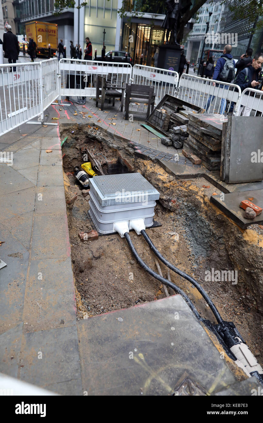 workers digging up road for electricity Stock Photo - Alamy