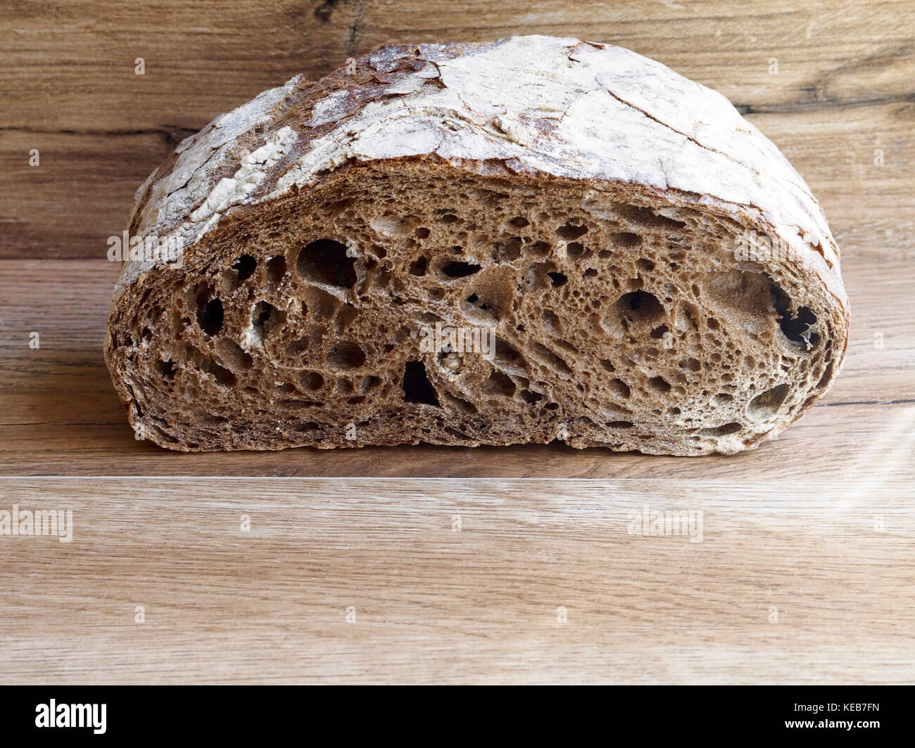 Malt rye bread on wood background Stock Photo - Alamy