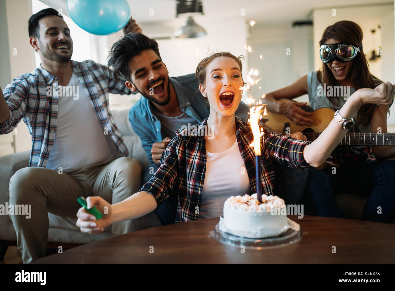 Cheerful young friends having fun on party Stock Photo - Alamy