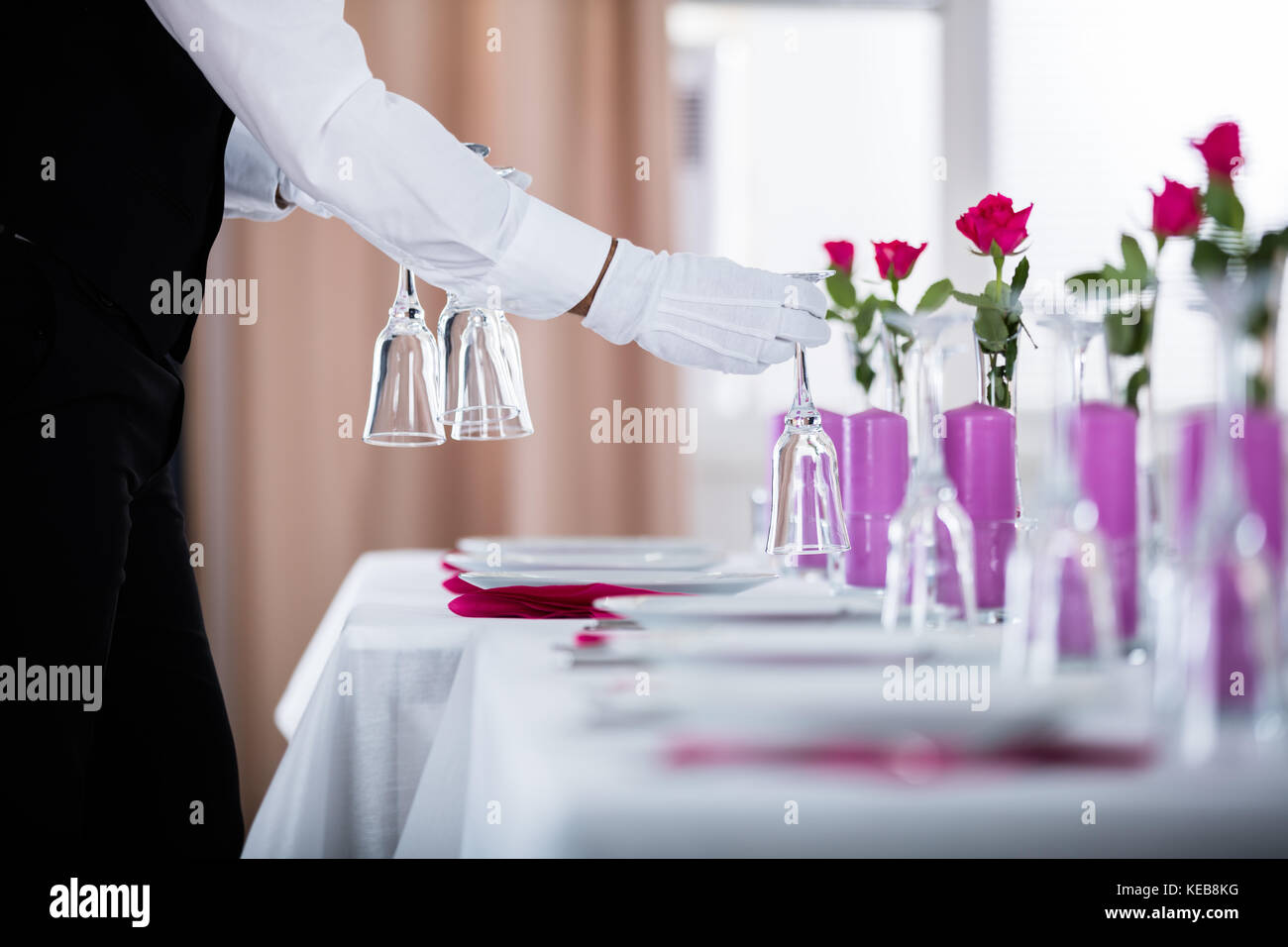 Close-up Of Waiter Setting Wedding Table At Restaurant Stock Photo - Alamy
