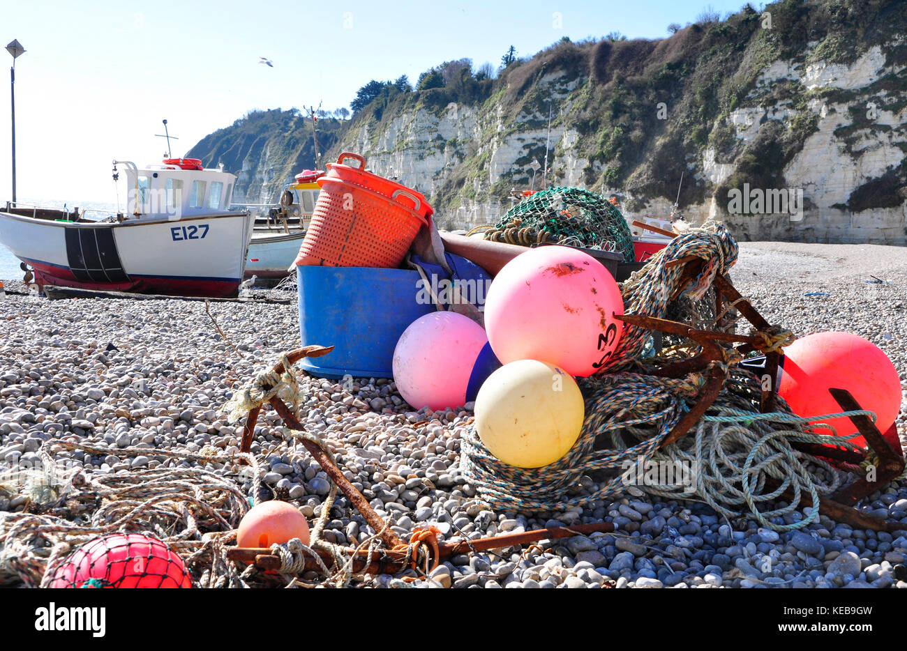 Boats and fishing gear on the beach at Beer in Devon, UK Stock Photo ...