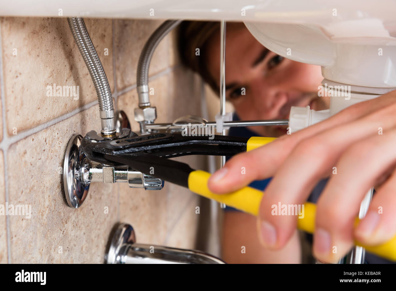 Close-up Of Male Plumber Installing Kitchen Sink Using Wrench Stock ...