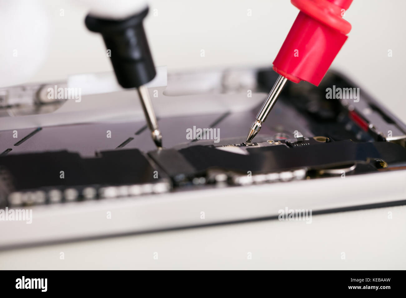 Close-up Of Multimeter Probes Testing Mobile Phone Stock Photo - Alamy