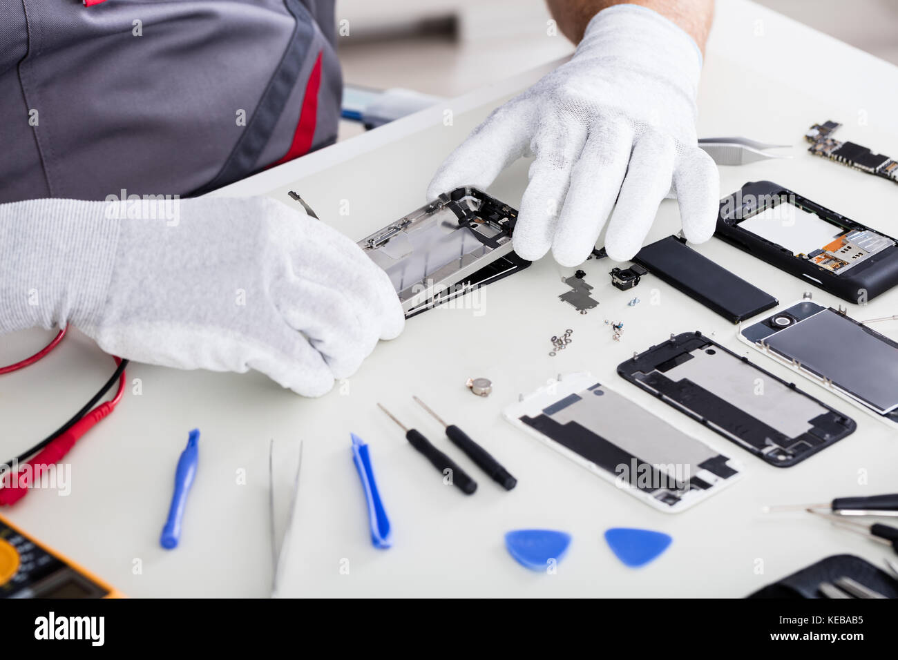 Close-up Of A Technician Hand Repairing Mobile Phone Stock Photo - Alamy