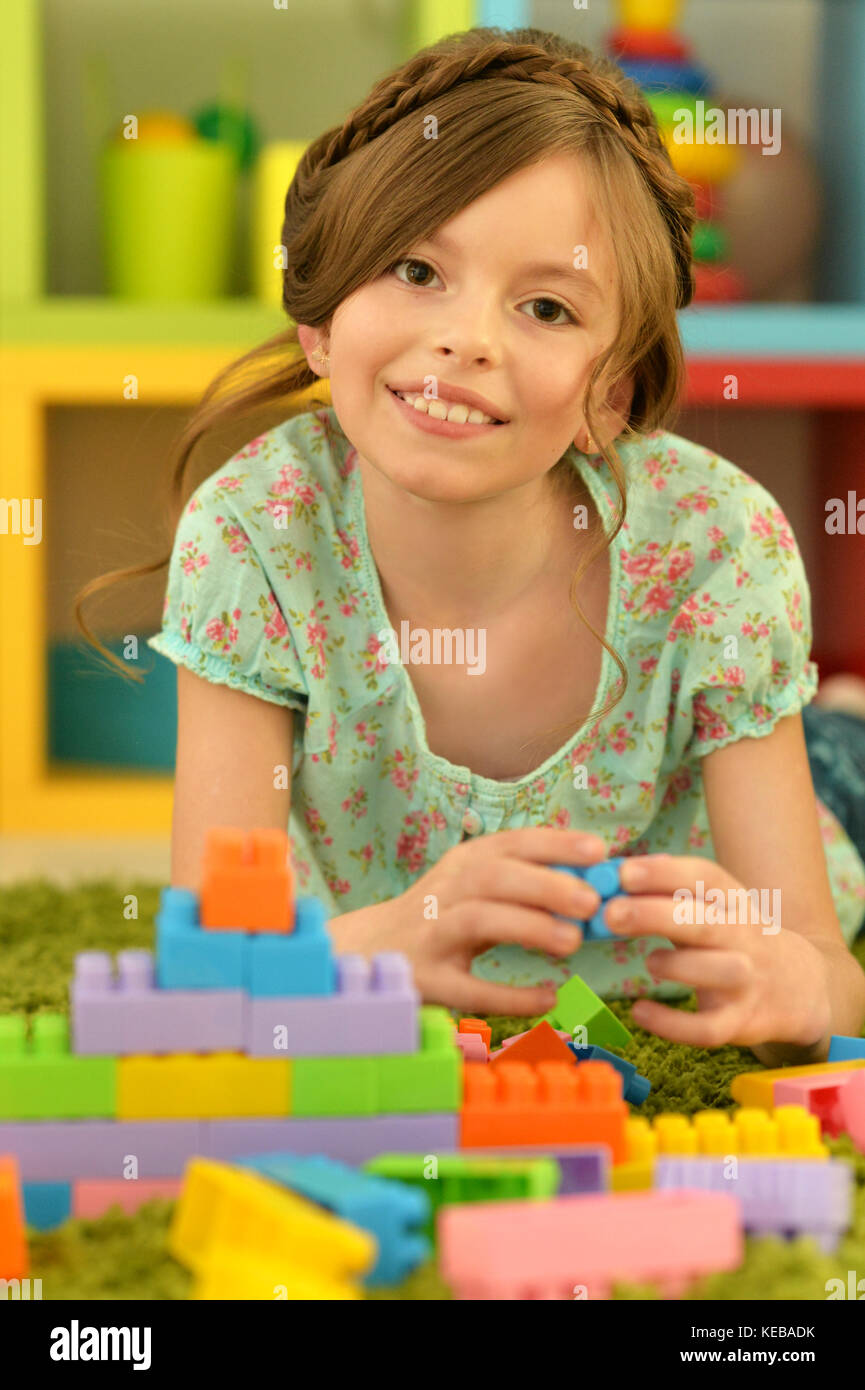 girl with colorful plastic blocks Stock Photo - Alamy