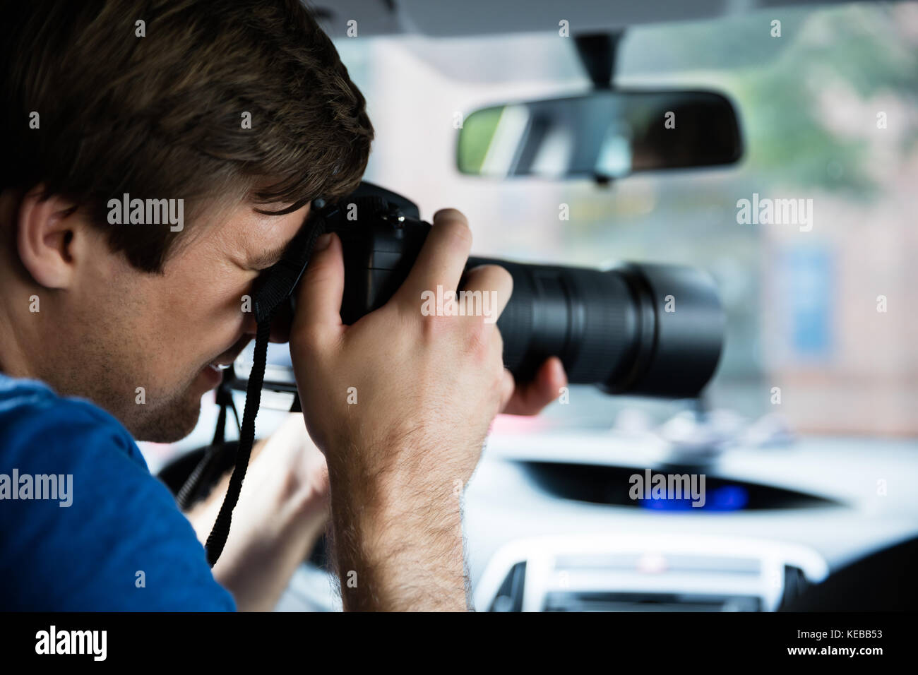 Man Sitting Inside Car Photographing With SLR Camera Stock Photo - Alamy