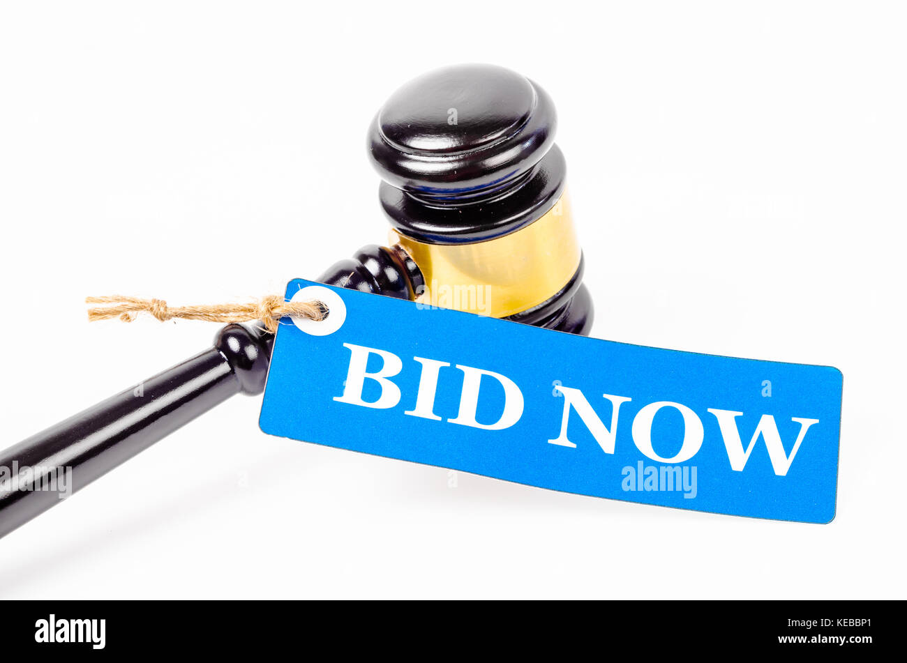 Bid now text on paper tag with wooden gavel auction isolated on white ...