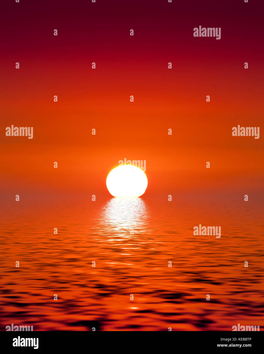 A beautiful golden sunset over calm ocean waters Stock Photo - Alamy