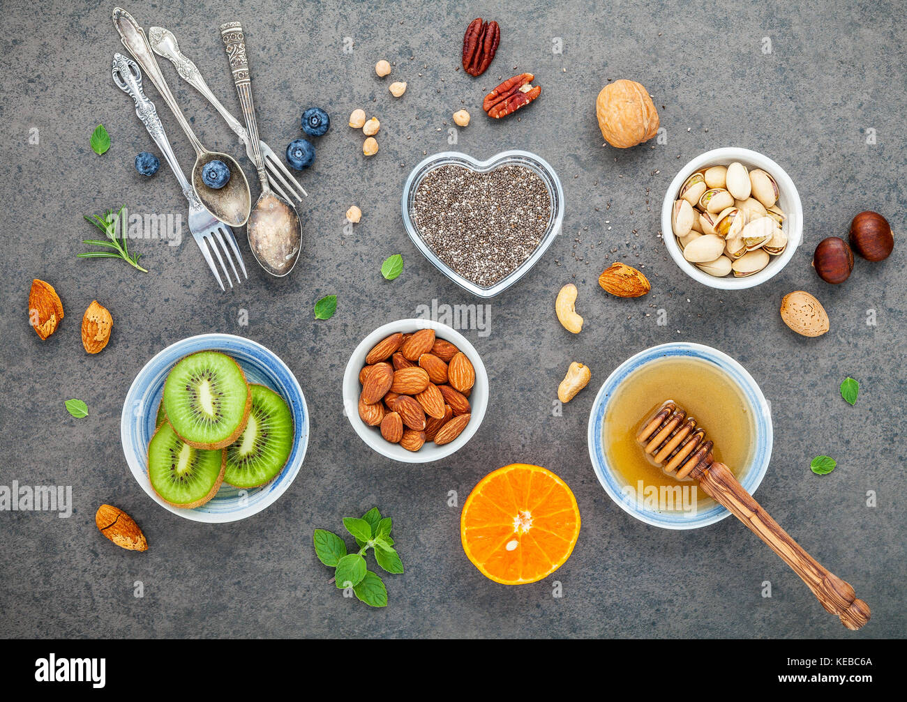 Ingredients for a healthy foods background, nuts, honey, berries ...