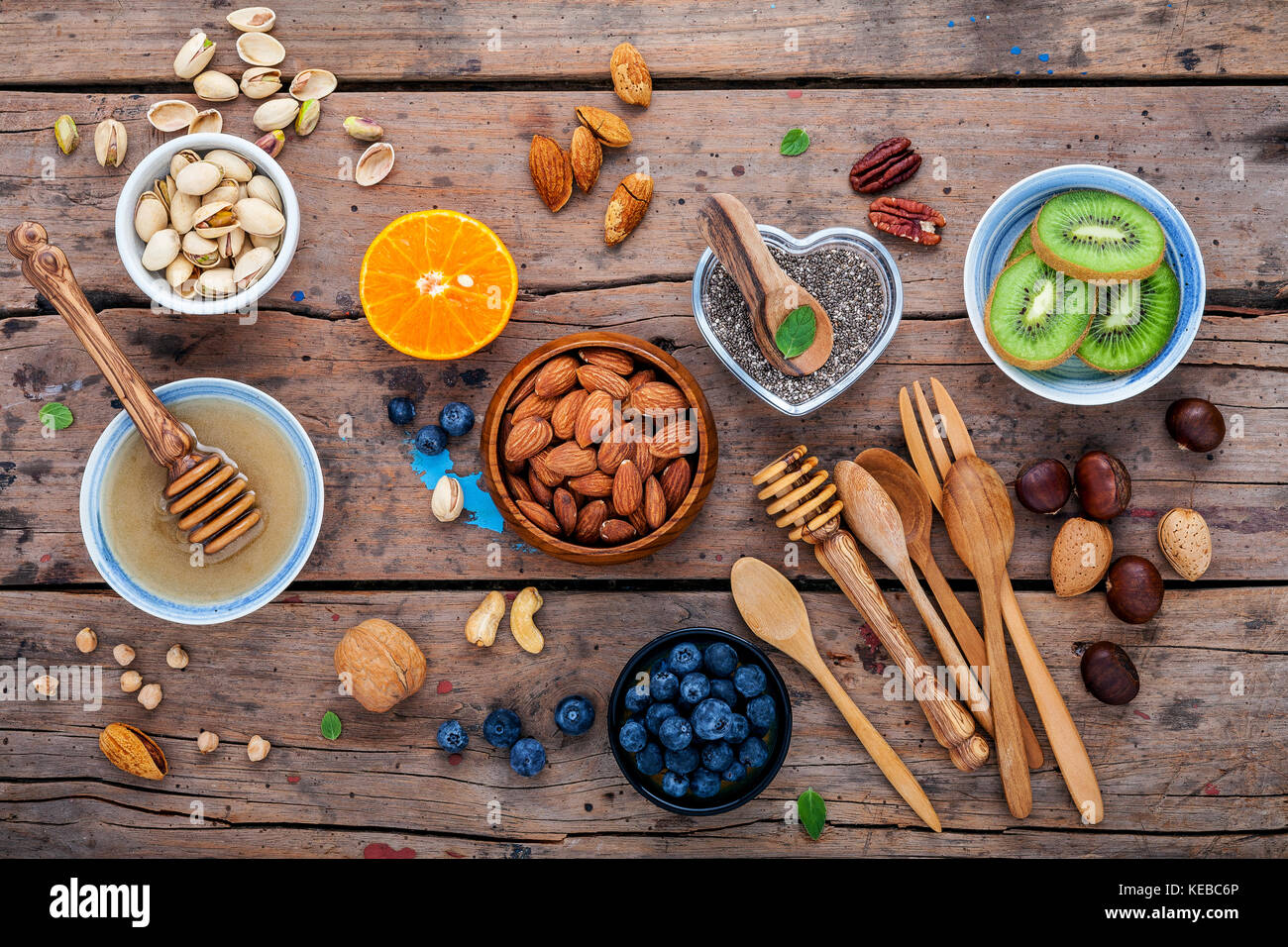 Ingredients for a healthy foods background, nuts, honey, berries ...